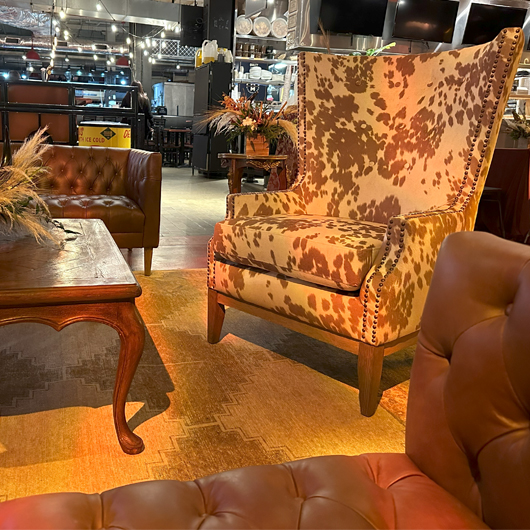 Cow Print Wingback Chair | Vision Furniture Event Rentals